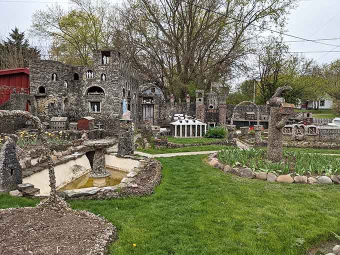 The fountain's gentle curves and stone-studded edges prove that water features can be both whimsical and wonderfully intricate.