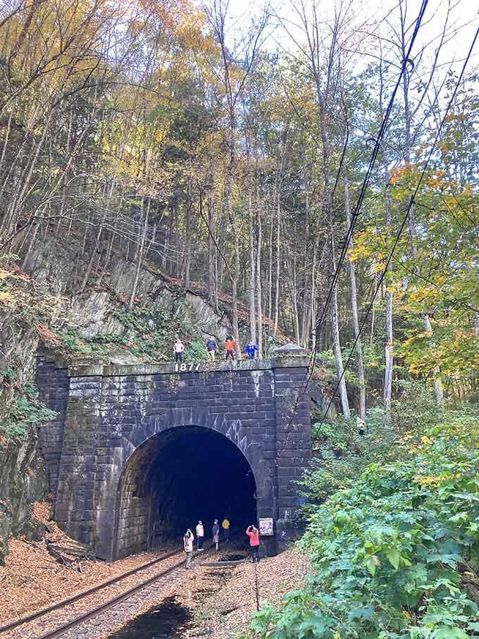 Nothing says "turn back now" quite like watching strangers disappear into five miles of mountain darkness and history.