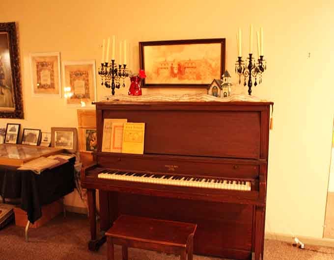 This vintage piano has witnessed countless gatherings, from hymns to funeral dirges to museum tours with curious visitors.