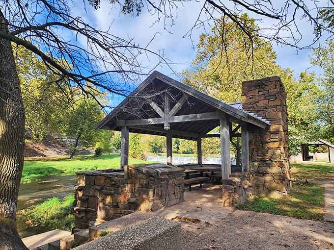 Stone and timber pavilions dot the park, offering shade without requiring an electrical outlet or Wi-Fi password anywhere.