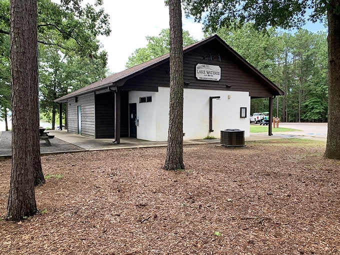 The community building stands ready for family reunions where everyone actually wants to attend for once.
