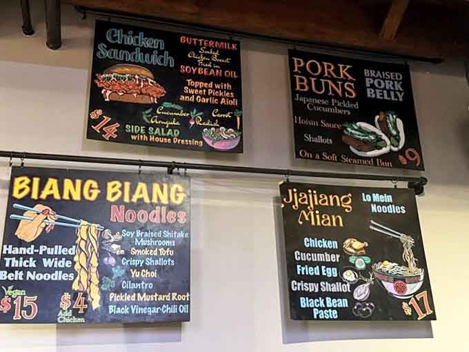 Those colorful menu boards aren't just decoration; they're your roadmap to hand-pulled noodles and sandwich perfection.