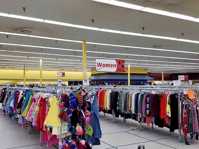 Racks stretching into infinity like a clothing lover's fever dream, organized chaos at its absolute finest.