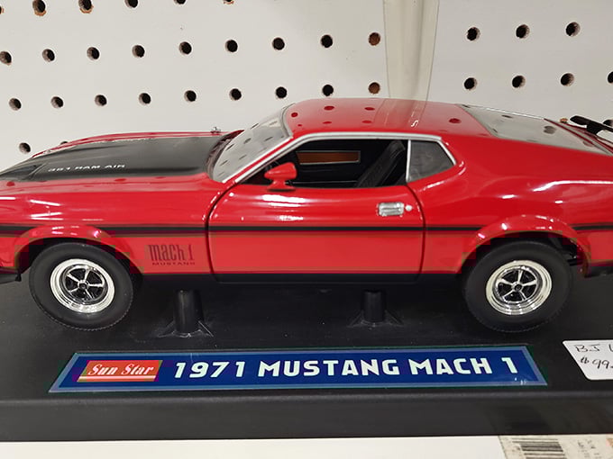 That cherry-red Mustang Mach 1 model represents every middle-aged dream of reclaiming youth, one collectible at a time.