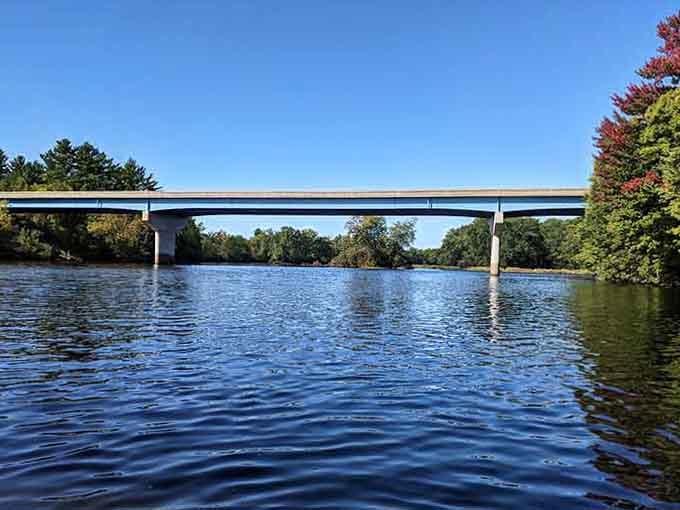 The Wisconsin River flows peacefully beneath modern bridges, offering waterfront views without the waterfront mortgage that usually comes attached.