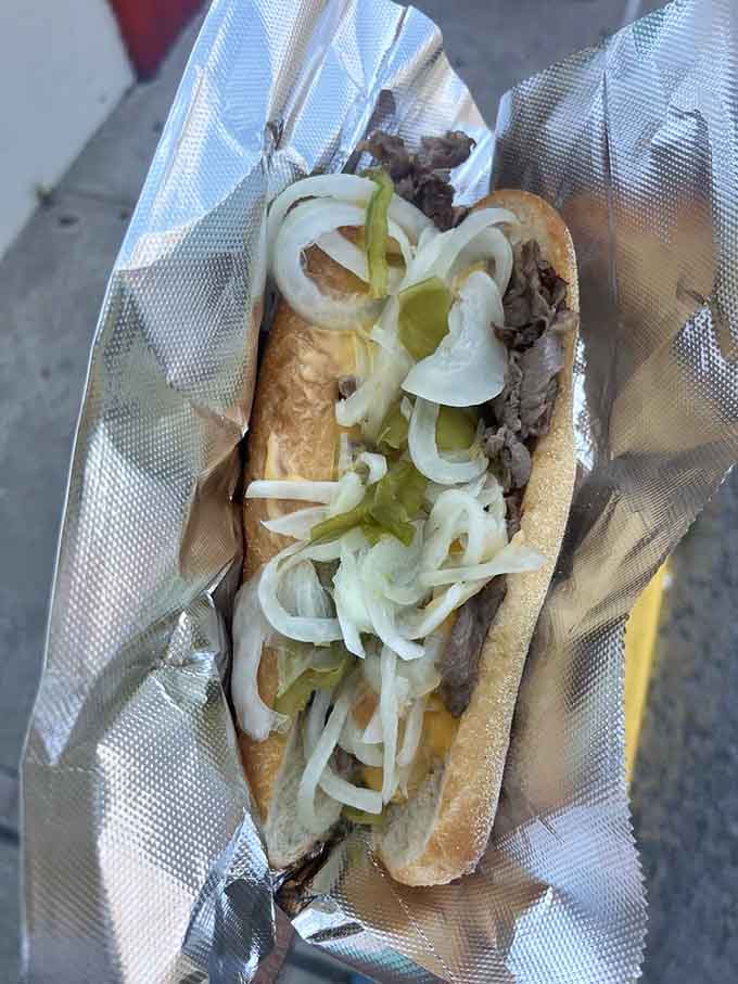 Behold the cheesesteak that launched a thousand return trips, wrapped in paper and ready for action.