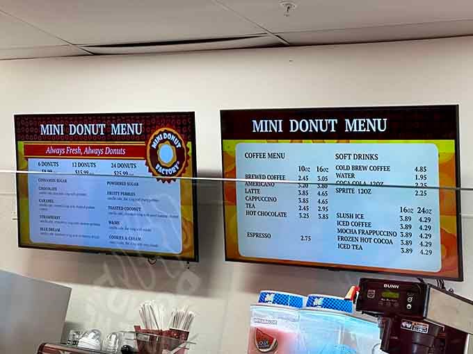 The menu boards tell a simple story: fresh donuts in multiple quantities, plus coffee that actually tastes like coffee.