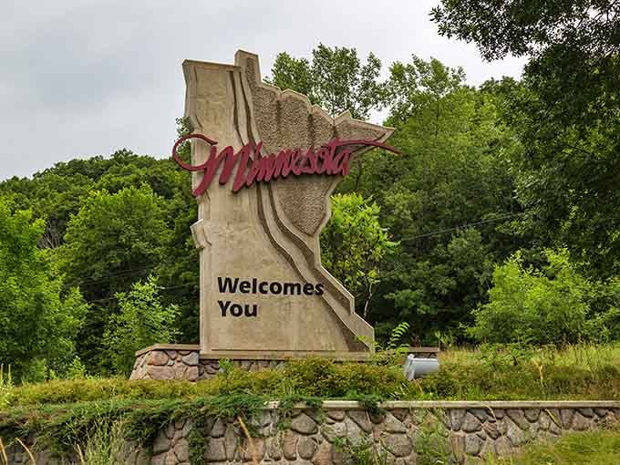 The monument stands proud against summer greenery, ready to mess with your GPS and your sense of direction.