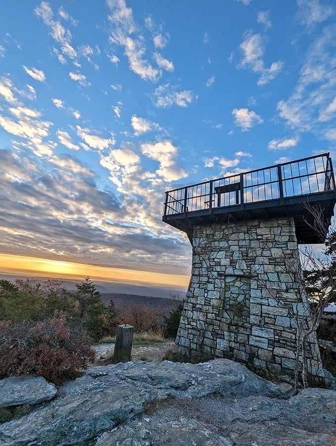 This stone observation tower stands like a sentinel, offering hikers their hard-earned prize: views that'll make your camera jealous.