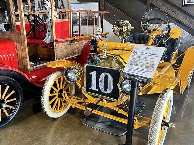 That cheerful yellow roadster with wooden wheels predates power steering by decades, proving our ancestors had serious upper body strength.