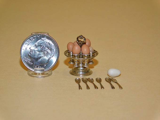 A dime for scale reveals eggs and spoons so tiny, even Thumbelina would need reading glasses.