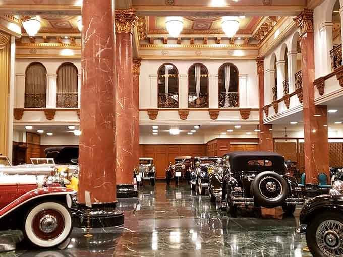 Those marble columns aren't holding up the ceiling; they're framing masterpieces that happen to have wheels and engines.