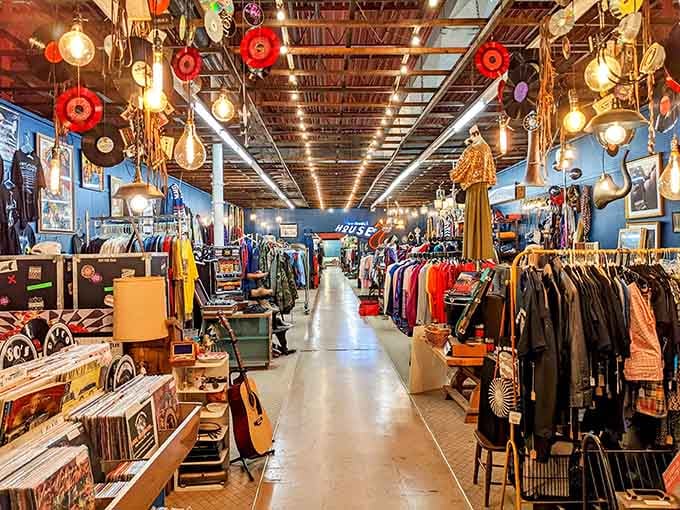 Vinyl records dangling overhead like musical stalactites, because apparently ceilings were feeling left out of the vintage party.