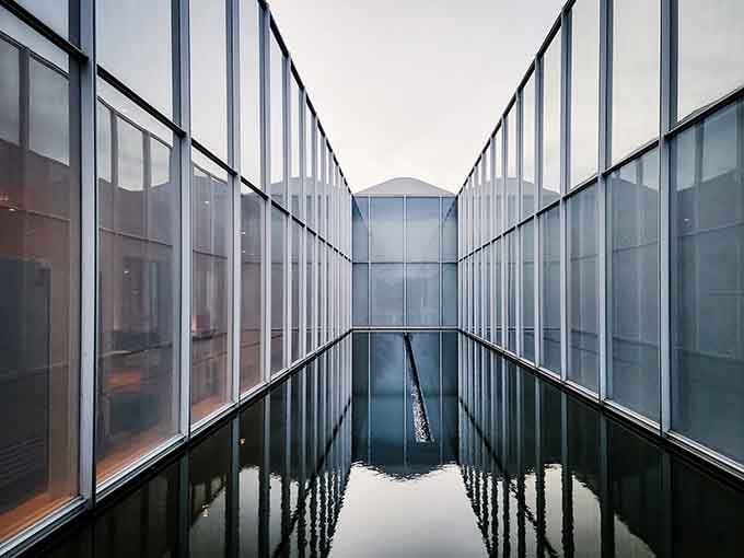 Glass and water create an architectural symphony that makes you question which way is up and which is down.