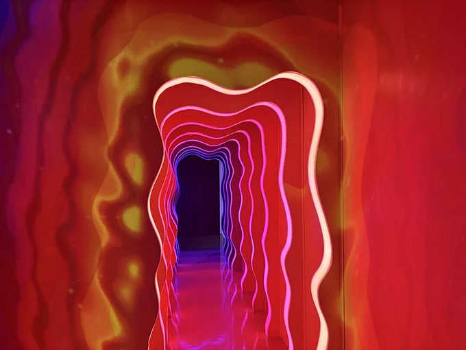 This neon tunnel looks like what happens when geometry decides to throw a rave party.