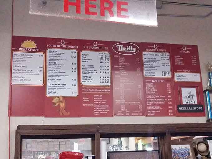 That red menu board promises everything from breakfast burritos to hot dogs, covering all the essential food groups of happiness.