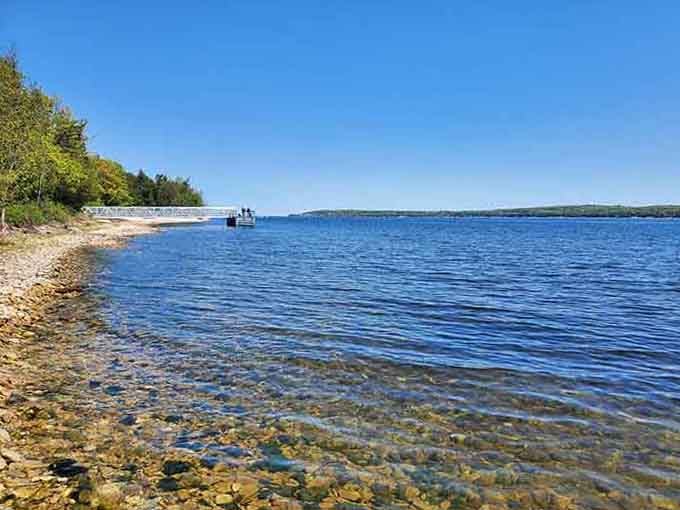 Crystal-clear waters meet rocky shores, proving nature doesn't need a filter to look this good.