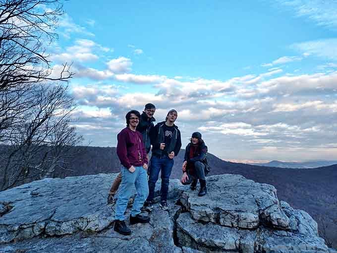 Nothing says "we conquered this mountain" quite like posing together on ancient rock with endless views behind you.