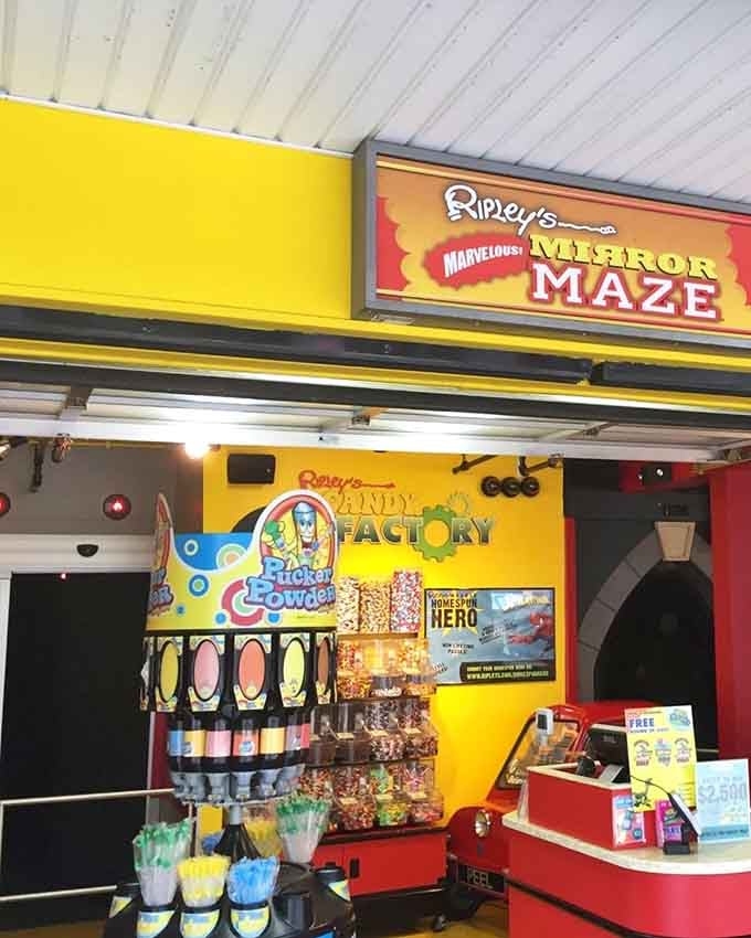 The candy factory entrance promises sweet treats before the maze scrambles your brain like morning eggs.