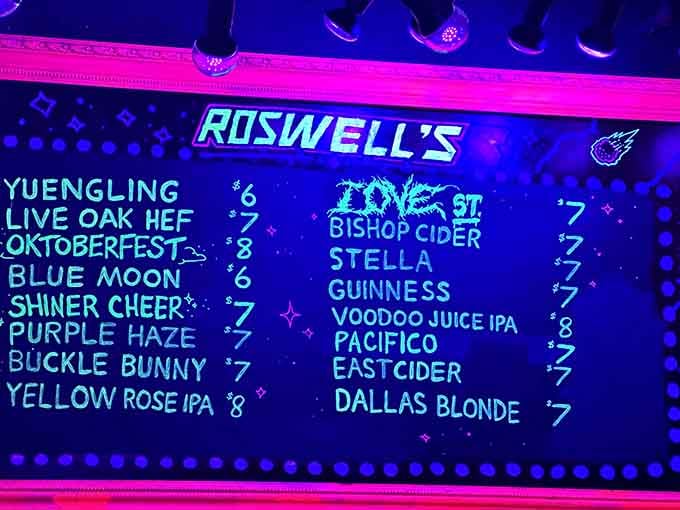Even the menu glows here, because apparently regular chalkboards are too boring for intergalactic drinking establishments.