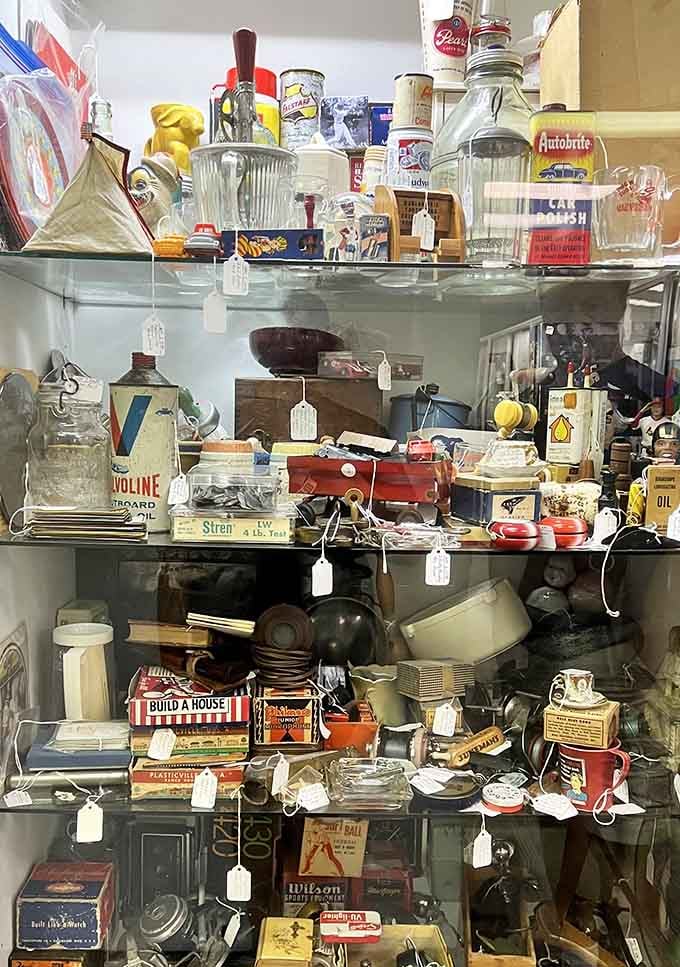 This glass case holds more nostalgia per square inch than your grandmother's entire attic, and that's saying something.