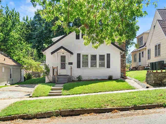 This classic white bungalow with black shutters represents the kind of affordable dream home that's become nearly extinct elsewhere.