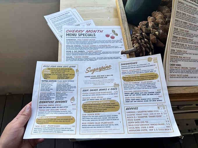 The menu spreads out like a treasure map, each item a delicious destination waiting to be discovered.