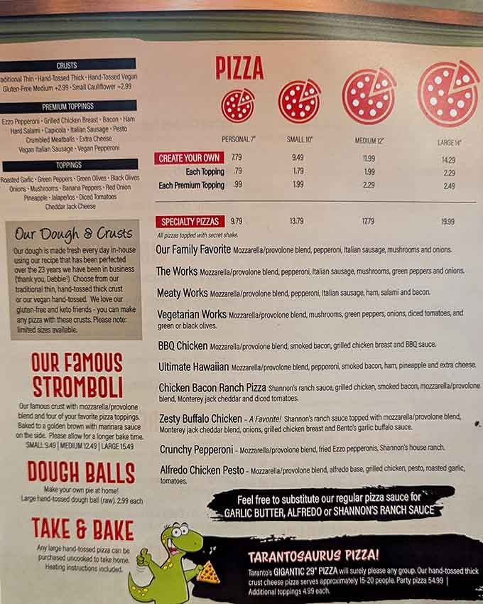 When a menu needs a dinosaur mascot to explain the pizza sizes, you know you're in for something gloriously ridiculous.
