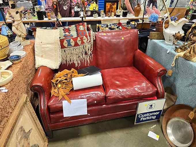 This buttery leather loveseat with studded details looks ready for its close-up in someone's cozy den.