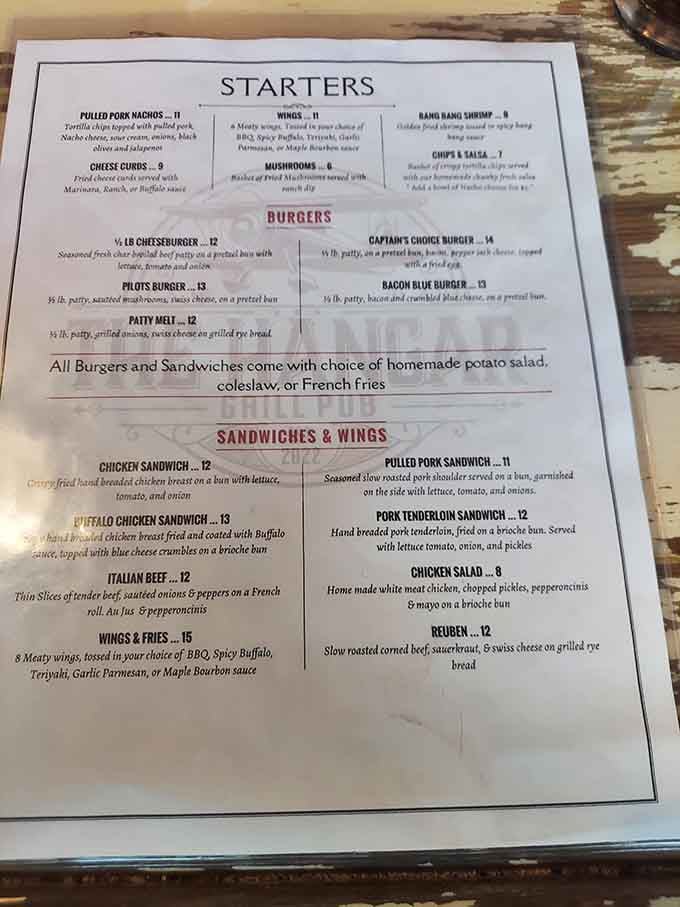 The menu reads like a greatest hits album of American comfort food with clever aviation-themed names throughout.