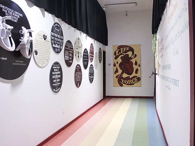 Rainbow floors and thought-provoking art make this hallway feel like Dorothy's yellow brick road got a serious upgrade.