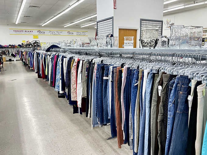 Denim for days, organized by color like a rainbow made entirely of practical pants choices.