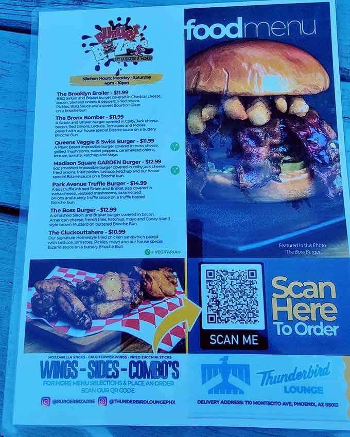 The menu showcases burgers with names like "The Boss" and "The Cluckoutahere," proving creativity extends beyond the decor.