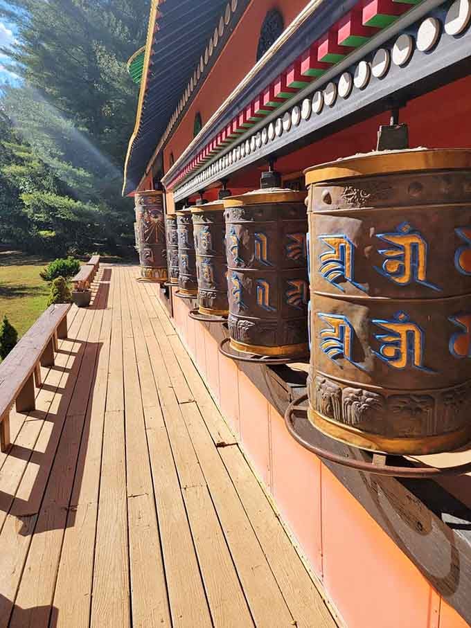 These prayer wheels line the walkway, inviting you to spin them and contemplate something deeper than your grocery list.