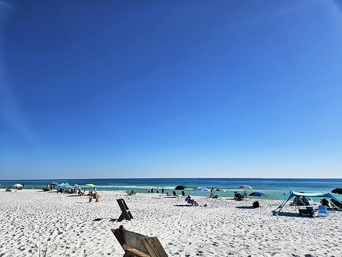 The dunes rise like natural skyscrapers, separating two completely different worlds just steps apart from each other.