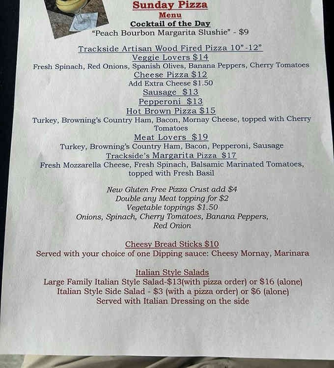 The Sunday pizza menu reads like a love letter to wood-fired perfection and creative bourbon cocktails.