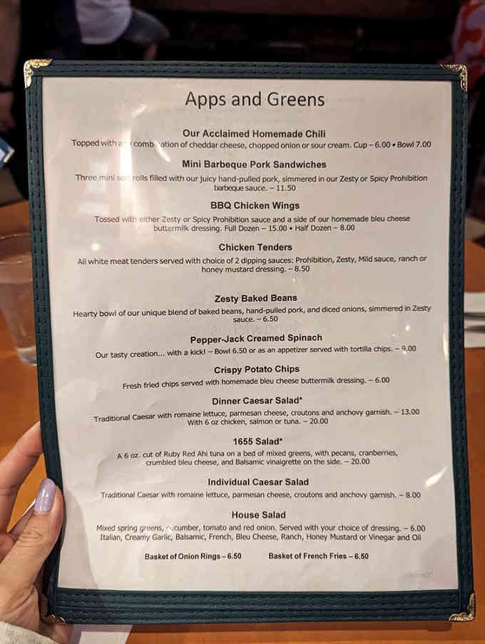 The menu reveals appetizers and salads that set the stage before the main barbecue event arrives.