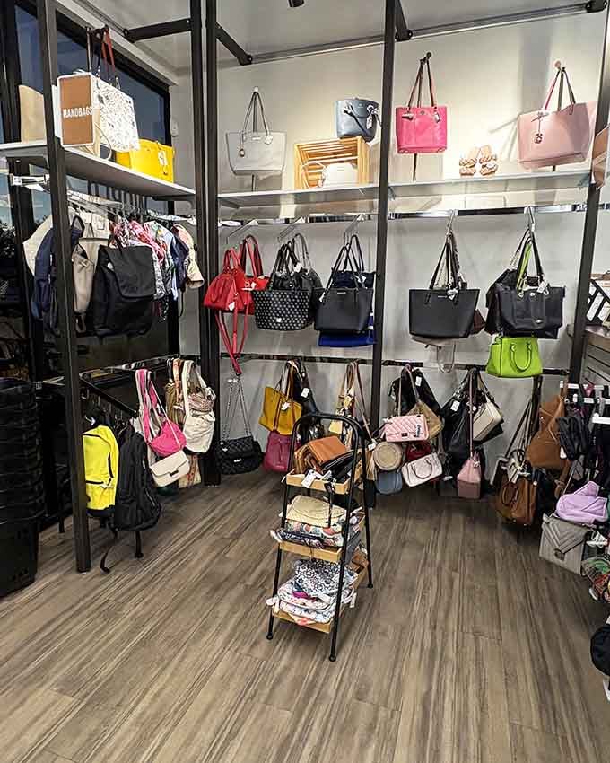 Designer handbags lined up like colorful soldiers, ready to rescue your outfit without requiring a second mortgage payment.