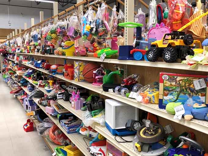 Toys stacked like a rainbow of childhood dreams, where every shelf holds someone's next favorite discovery.