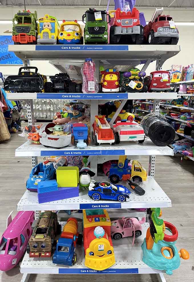 Toy cars and trucks lined up like a miniature parking lot, waiting for their next adventure with new owners.
