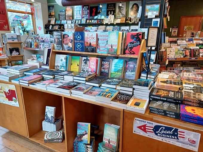 Village Books and Paper Dreams books displayed on wooden tables tempt you with bestsellers and hidden literary gems.