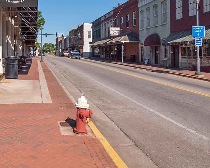 That fire hydrant stands guard over empty streets where time moves slower and nobody minds one bit.