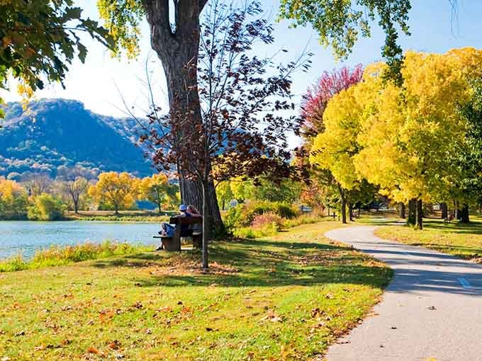 Fall colors explode along the lakeside path where locals stroll beneath trees that put on their annual Technicolor show perfectly.