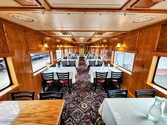 White tablecloths and wood paneling prove that dining cars were the original farm-to-table experience, just mobile.