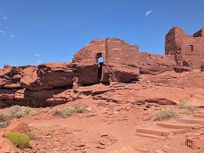 Pueblo ruins rising from red earth, testament to engineering skills that still impress today.