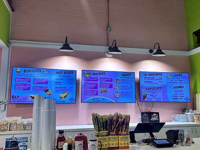 Those glowing blue menu boards make ordering feel like you're at the world's happiest space station diner.