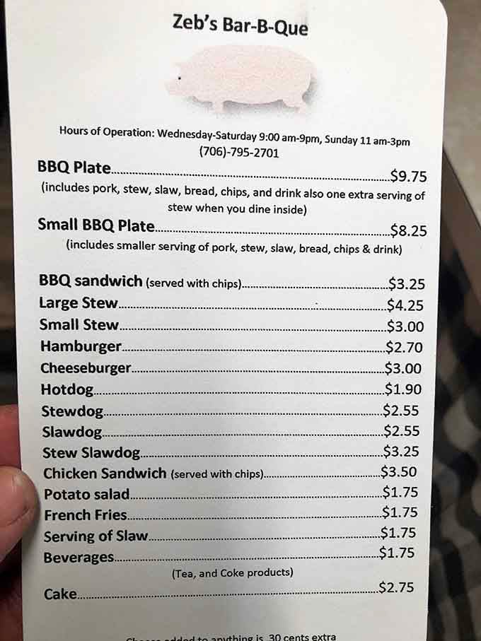 That adorable pig logo says it all: simple menu, serious barbecue, zero pretension required at the door.