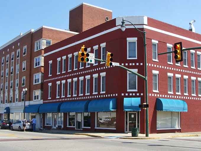 Those bright blue awnings pop against red brick like a postcard from America's most affordable downtown.