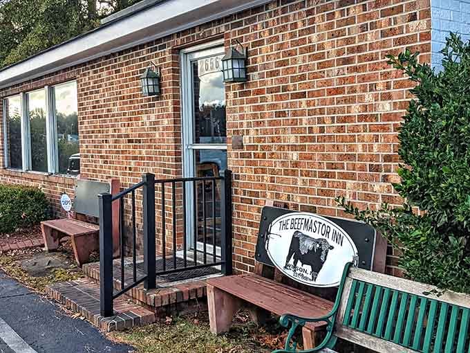 That cow sign tells you everything – this brick building is where beef dreams come true, one tender cut at a time.