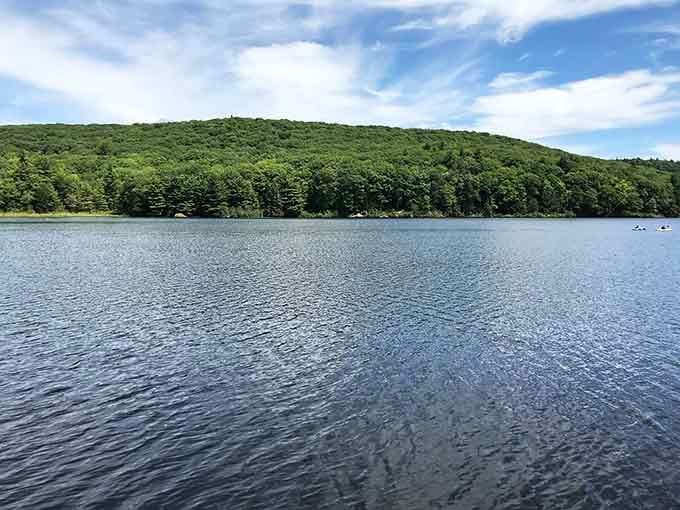 Mirror-smooth water reflects green hillsides so perfectly, you'll wonder which way is up in this peaceful paradise.